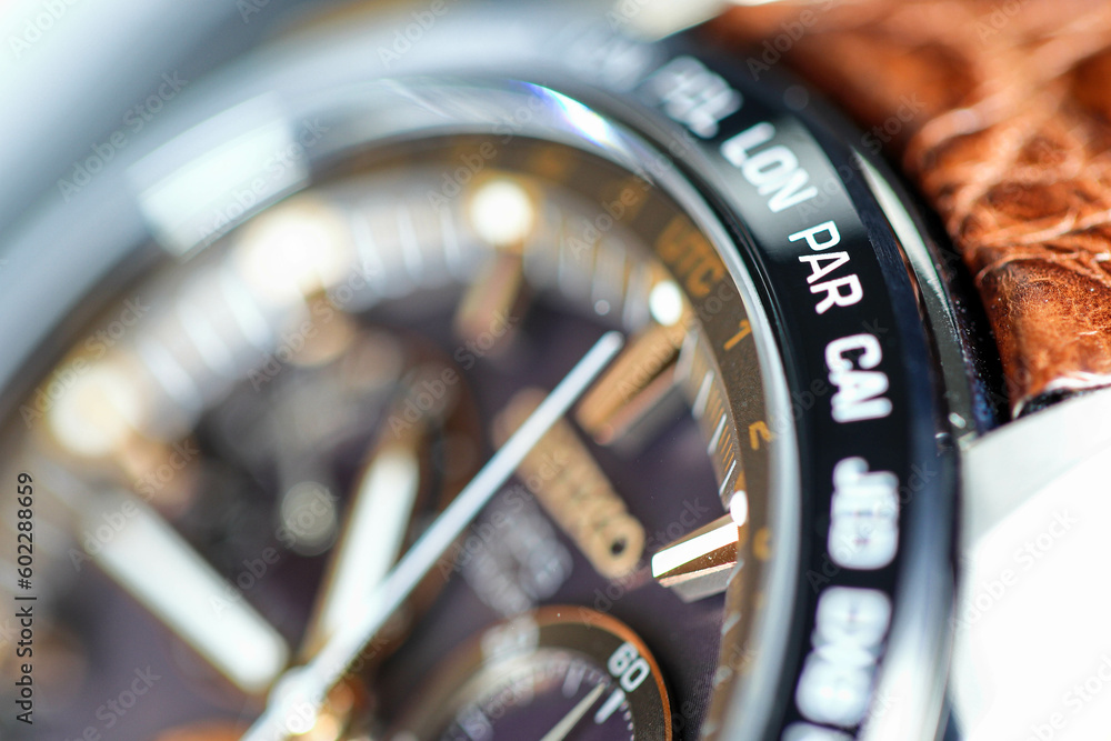 close up shallow focus Time zone cities code on luxury world time watch ...