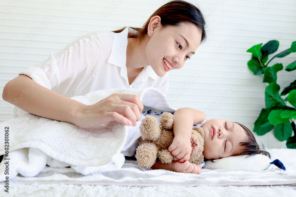 Cute toddle baby girl infant sleeping on white bed, young beautiful ...
