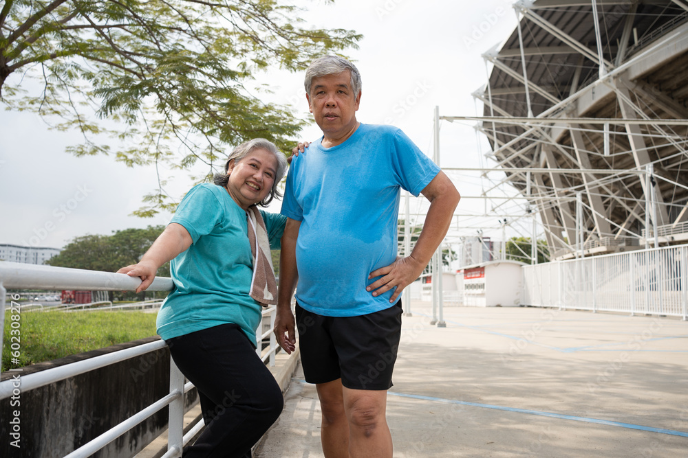 Happy and smile couples elderly asian standing on stairs for rest after ...