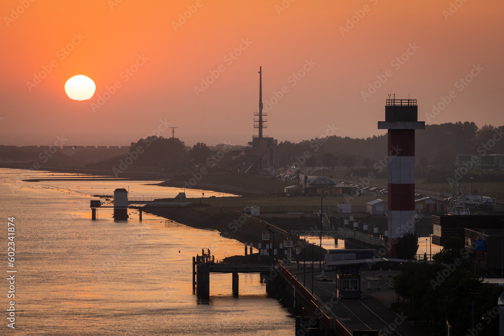 glorious sunset on waterline of Dutch port harbour dock in Hook of ...