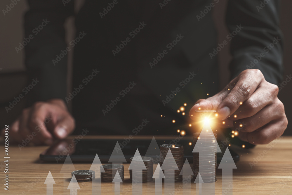 Save money and investment growth concept. Businessman hand holding coin ...