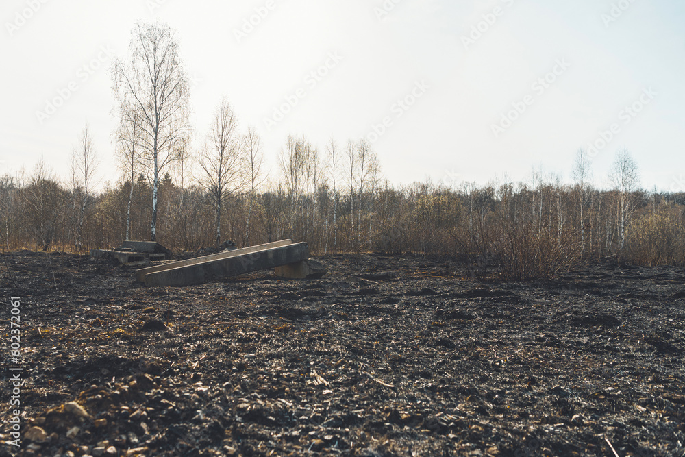 Remains of a destroyed building. scorched earth. Consequences of the ...