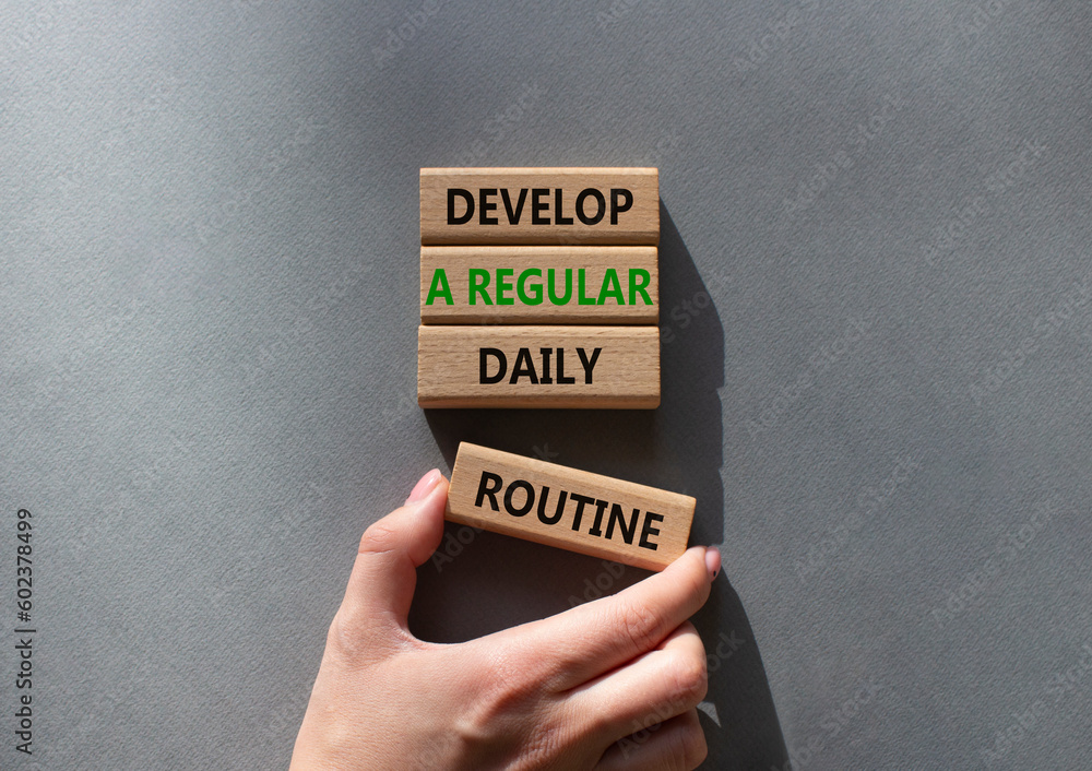 Foto de Develop a regular daily routine symbol. Concept words Develop a ...