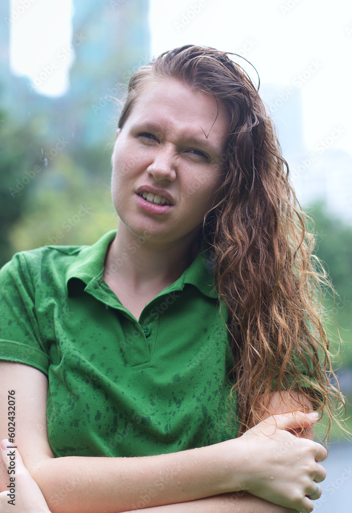 Sad woman under summer rain.emotional girl wet in the rain without ...