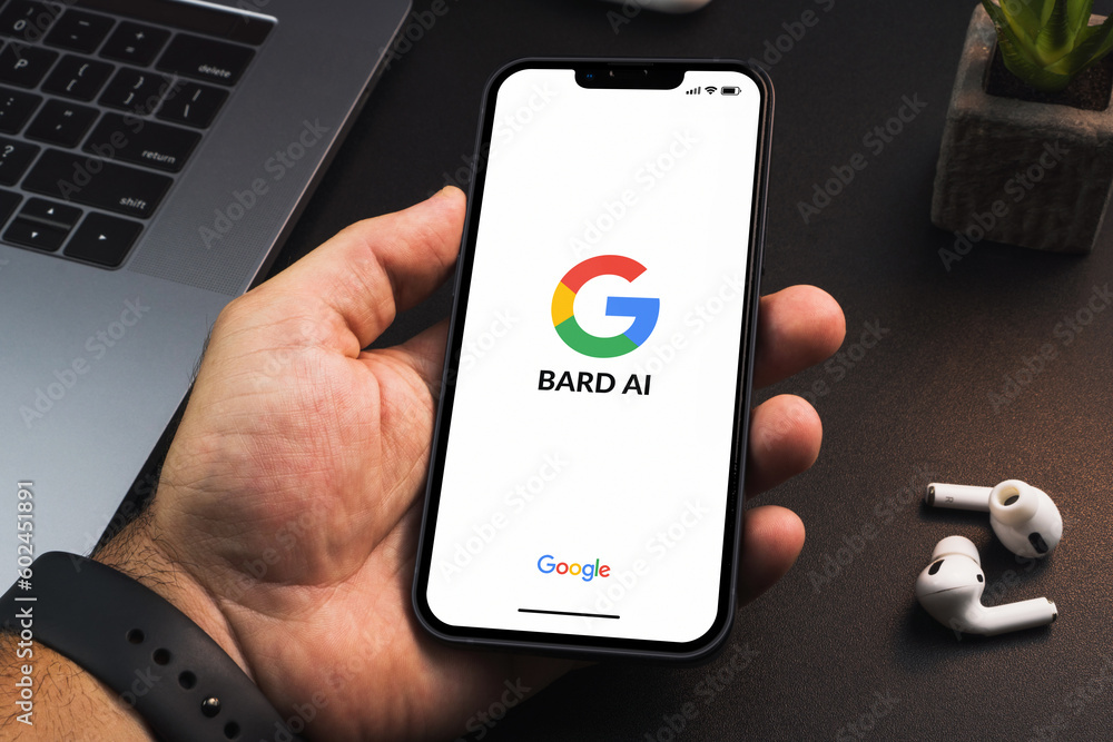 Man holding a smartphone with Google Bard AI artificial intelligence ...