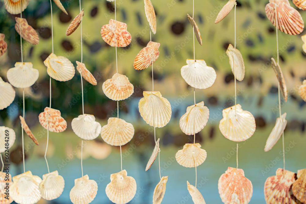 Scallop shells on fishing lines. Bay House on an island near Nha Trang ...