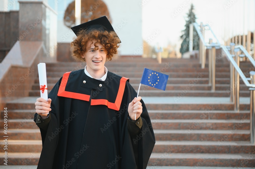 Graduation from university. Young smiling boy university graduate in ...