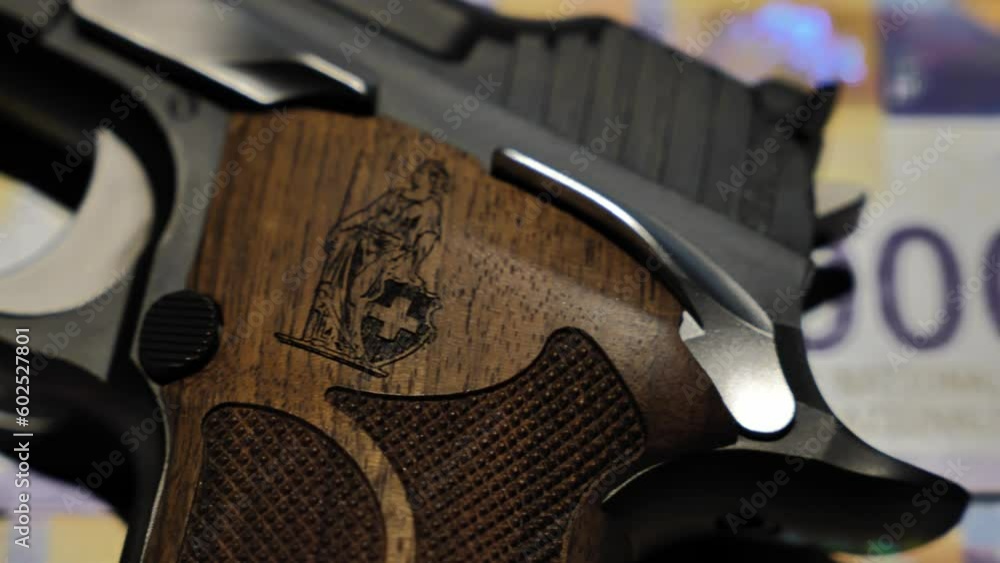 Elegant Semiautomatic 9mm Handgun with Swiss Helvetia Symbol Leaning on ...