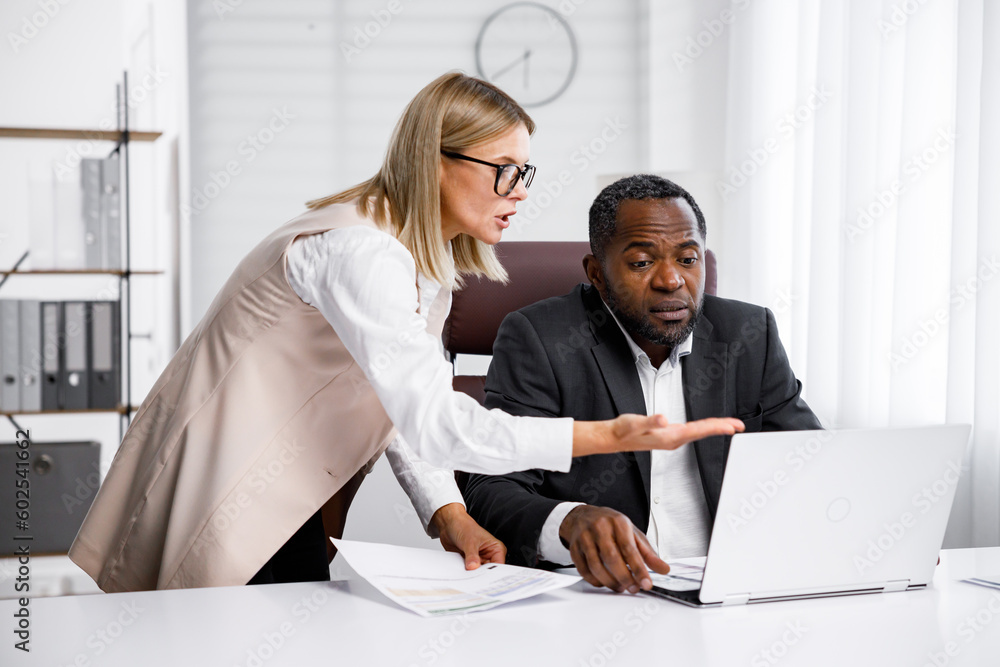 Angry Female Boss Scolding African American Office Worker A Demanding