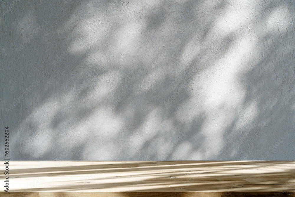 Table shadow background. Wooden table and white empty wall with plant ...