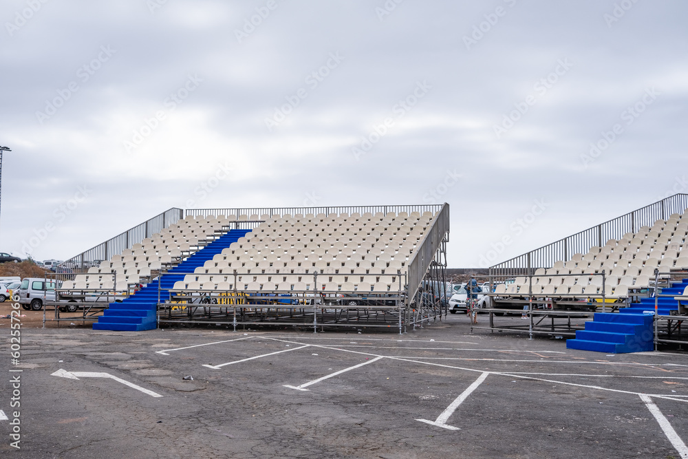 bleachers installed on the esplanade of a public parking lot for an ...