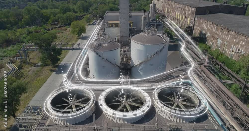 Industrial cooling towers with futuristic graphics. A futuristic shot ...