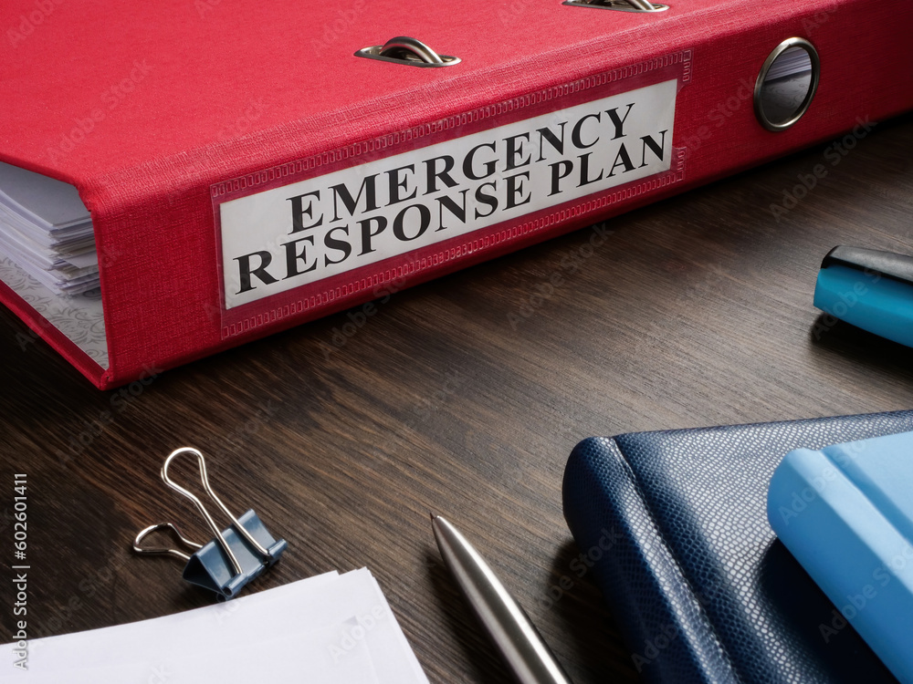 Red folder with Emergency response plan on the desk. Stock Photo ...