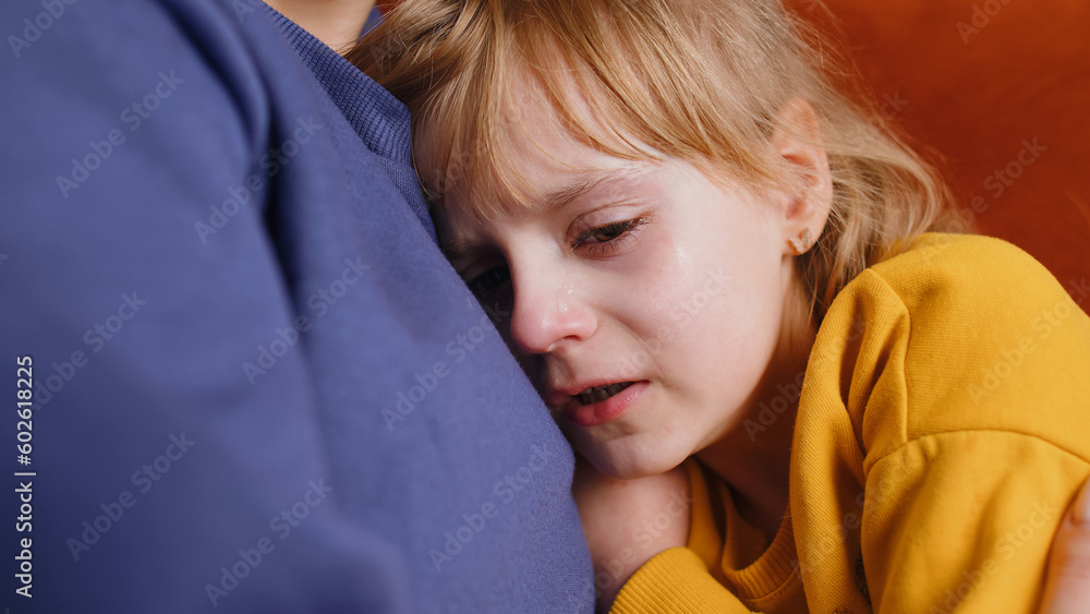 Close-up portrait of upset child little girl kid crying with tears ...