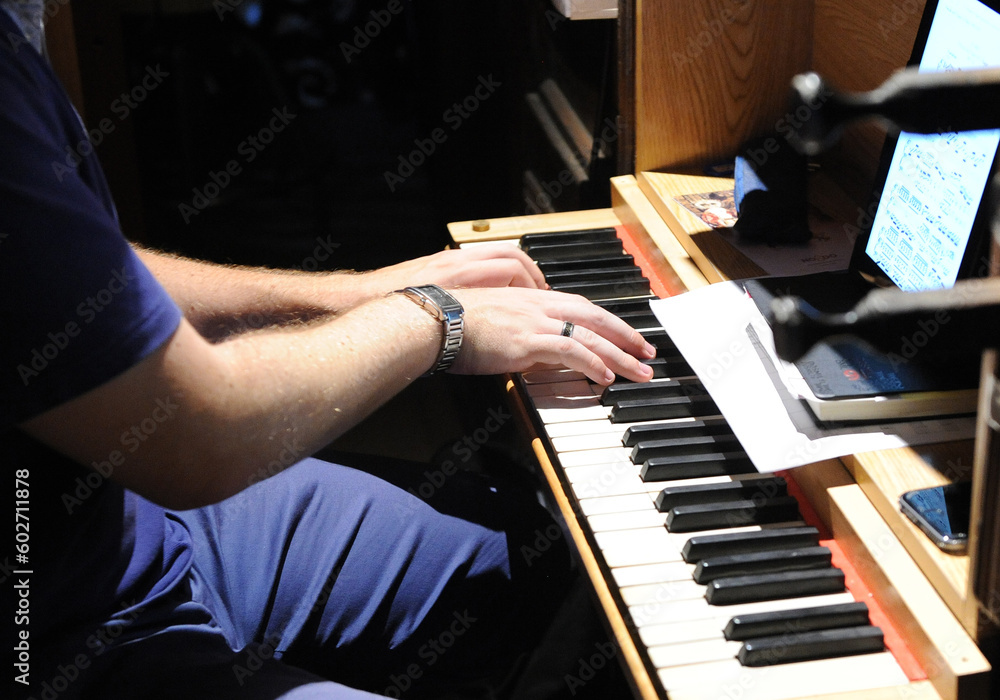 Organist musician repairing and tuning a church pipe organ. Musician ...