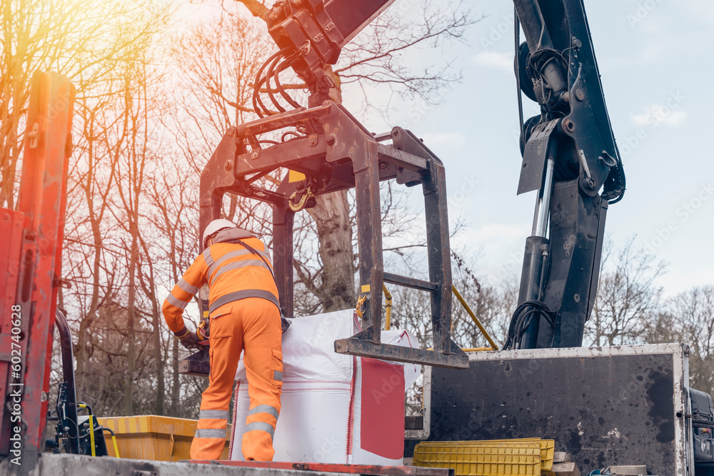 Dropside flatbed HIAB crane lorry with brick grab attachment deliver ...