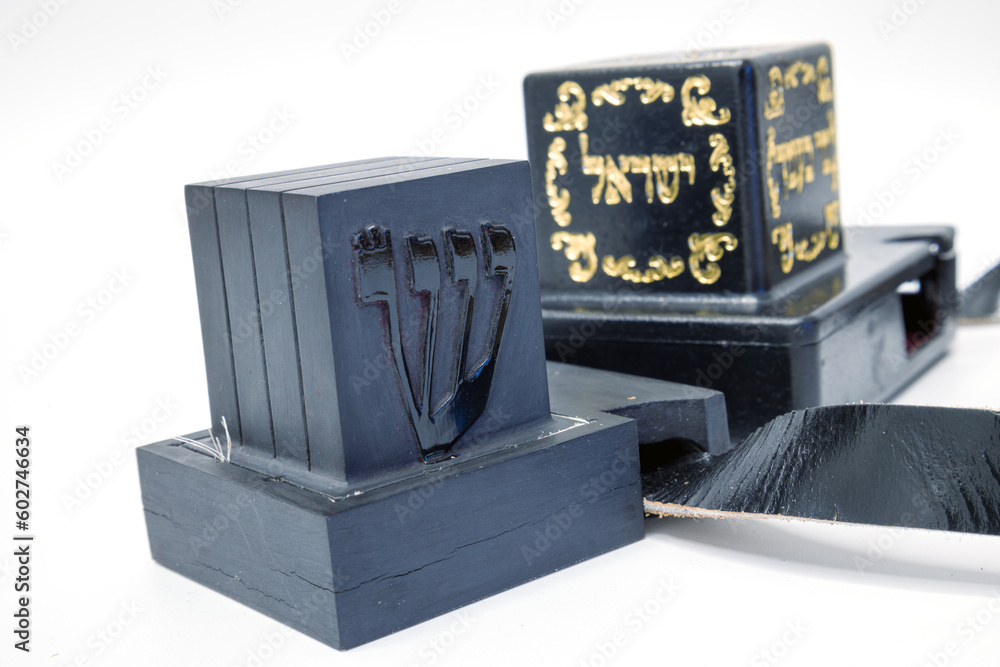 Tefillin or phylacteries . Pair of black leather boxes for the arm and ...