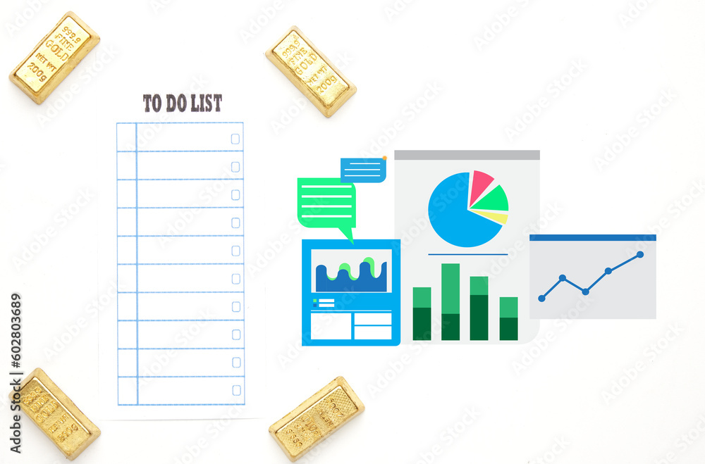 Flatlay picture of to do list paper with miniature gold bar with ...