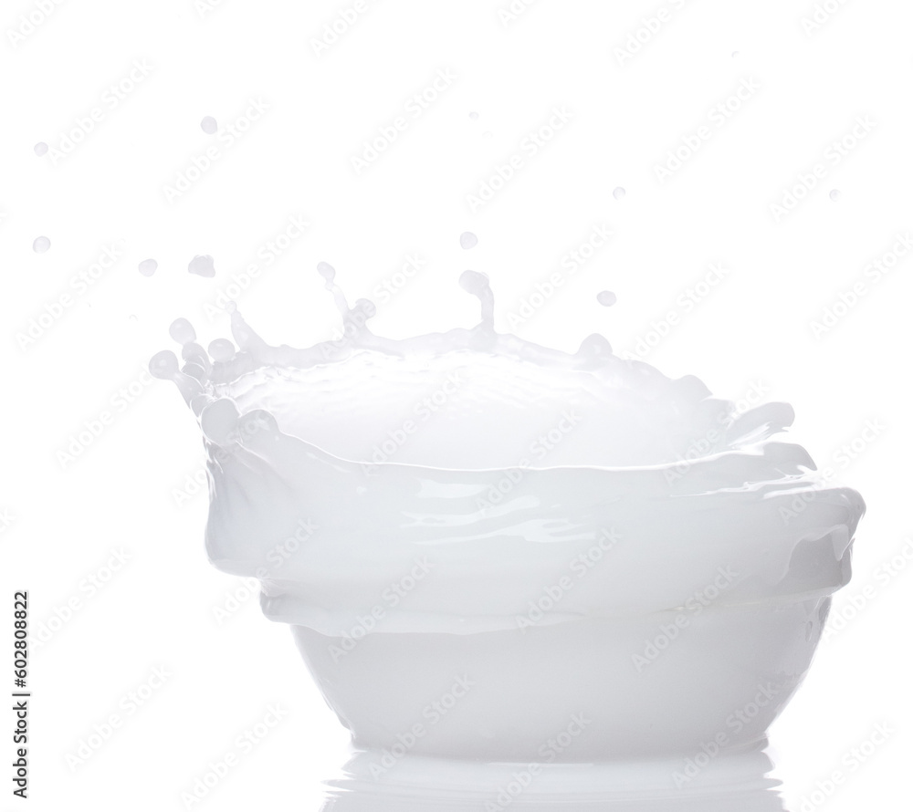 Milk yogurt white water spill splash from bowl up. Milk lotion pour ...