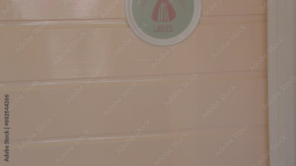 This video shows a ladies restroom sign with a princess theme. Stock ...