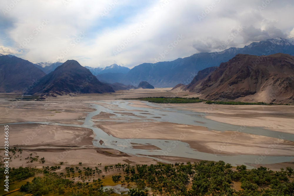 beautiful river and dune desert in the mountains, cold desert in skardu ...