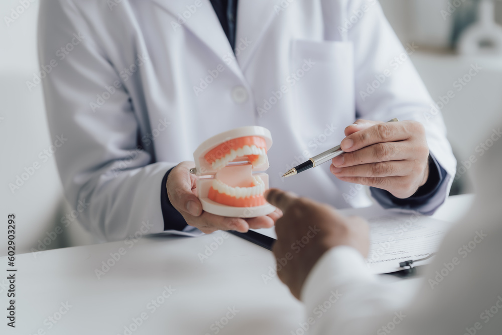 dentist and patient discussion about planned teeth treatment in dental ...