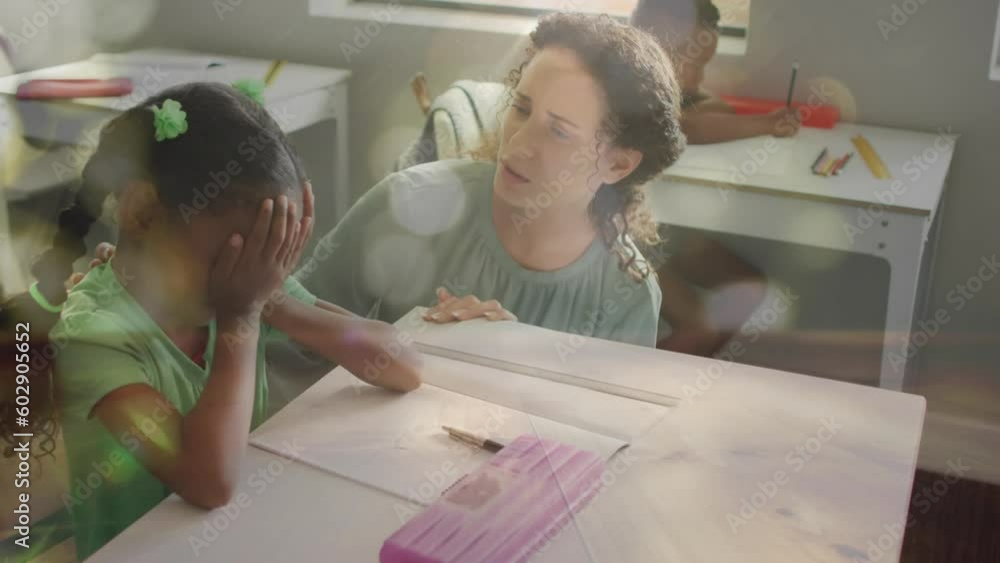 Animation of bokeh lights over diverse female teacher talking to sad ...