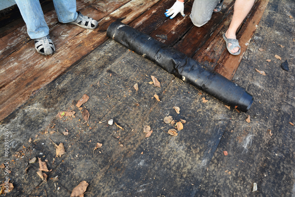 Repairing a run down, old and bad roof sheathing by removing old wet ...