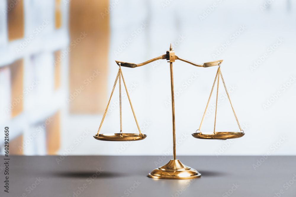 Shiny golden balanced scale in court library background as concept ...