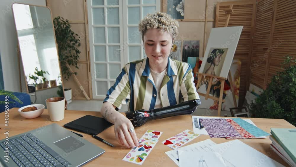 Stylish gen Z influencer with disability wearing arm prosthesis ...