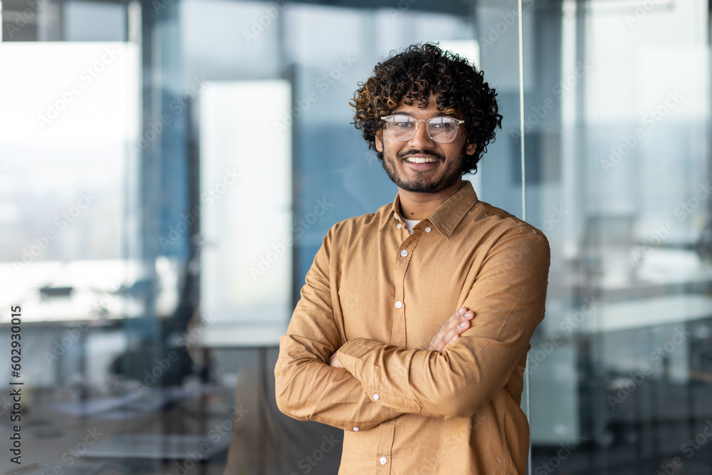 Portrait of a young Indian designer, programmer, businessman standing ...