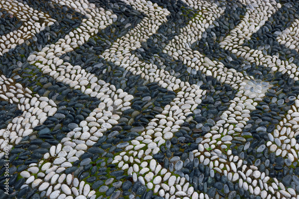 Round cobblestone rocks creating a chevron pattern walking path in The ...