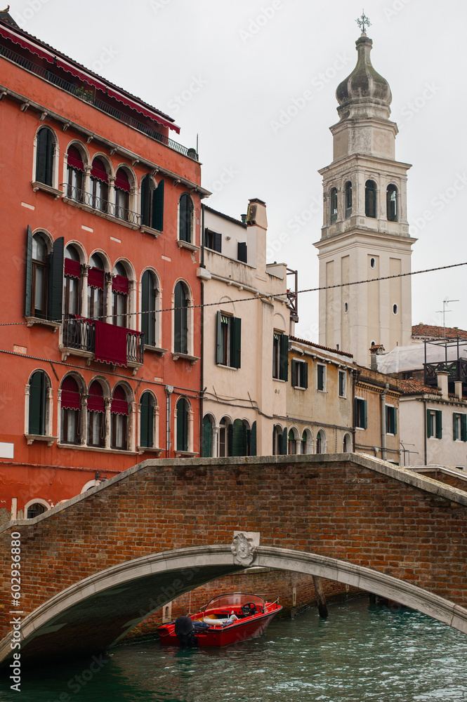 Narrow canals of Venice city with old traditional architecture, bridges ...