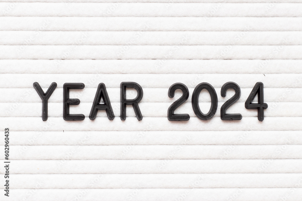 Black color letter in word year 2024 on white felt board background ...