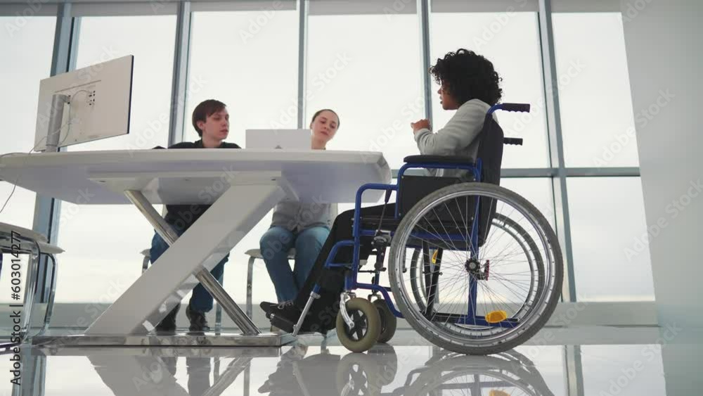 African american girl with physical disability in wheelchair on job ...