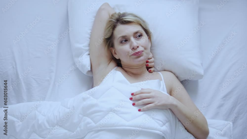 Nervous sleepless woman turning in bed, feeling problems with sleep ...