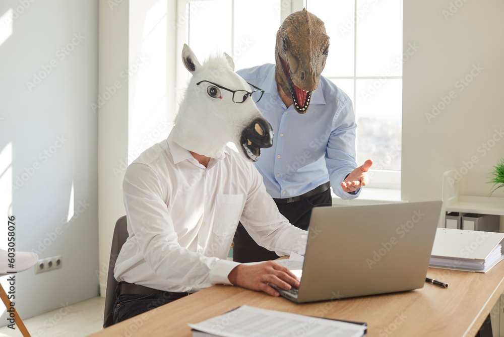 Foto de Funny animal people work in office. Two men in unusual disguise ...