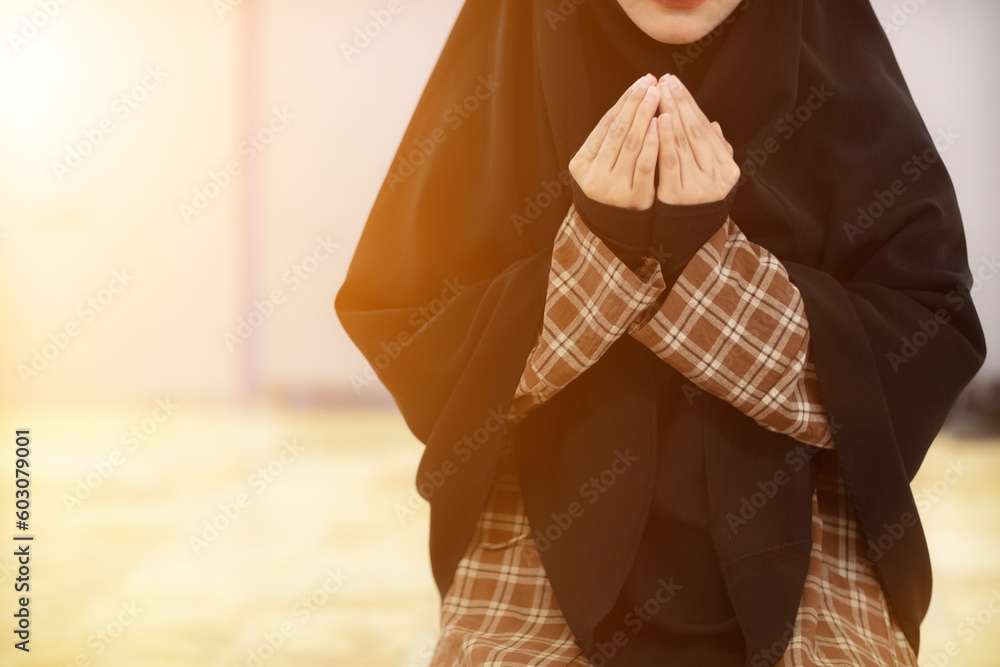 muslim women in hijab are praying to show respect and thanks to allah ...