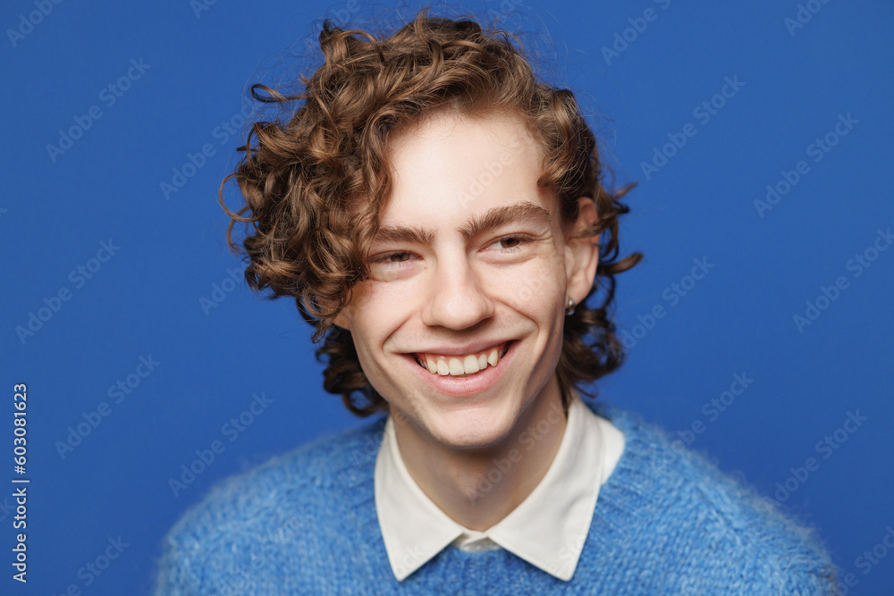Toothy grin. Headshot. Androgyne face. Blue Background Stock Photo ...