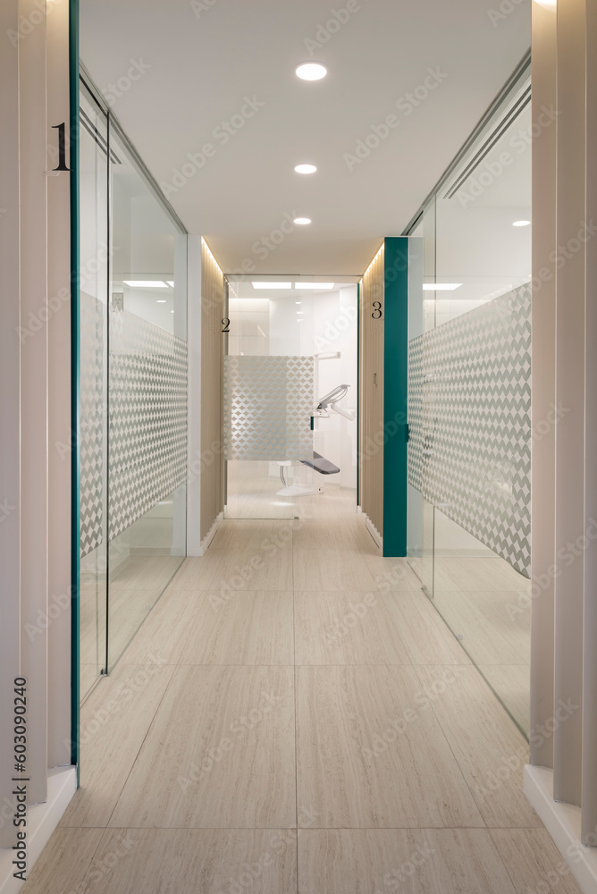 Modern clinic common space with a large corridor and different offices ...