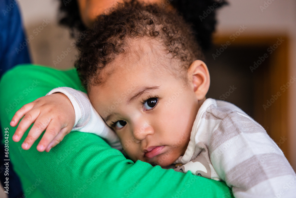 Cute mestizo boy hugging mother Stock Photo | Adobe Stock