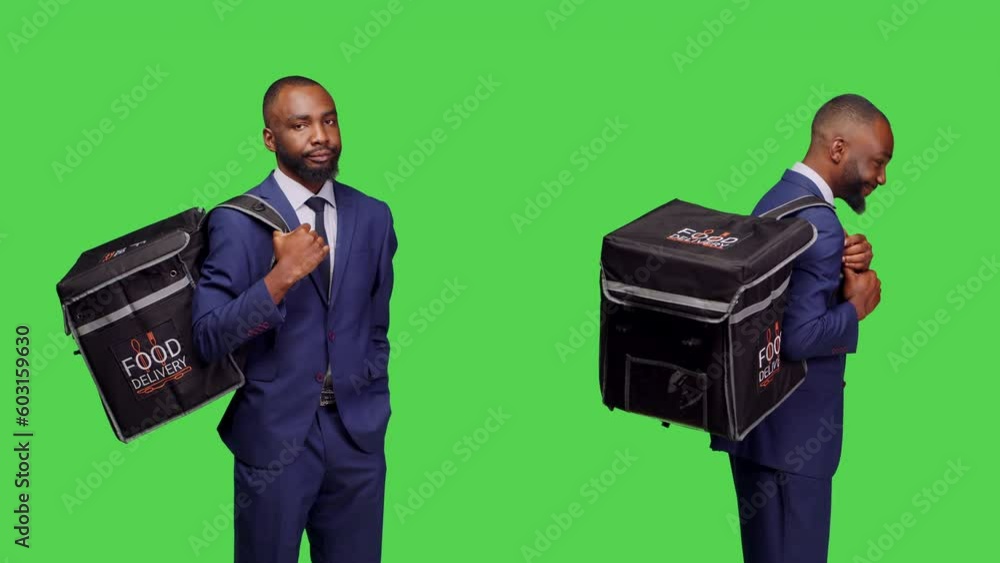 Deliveryman with formal suit carrying thermal backpack on greenscreen ...