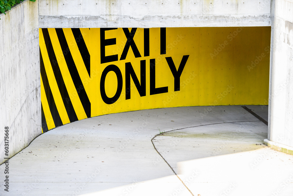 Foto de Exit only sign on entire wall of underground garage exit do ...