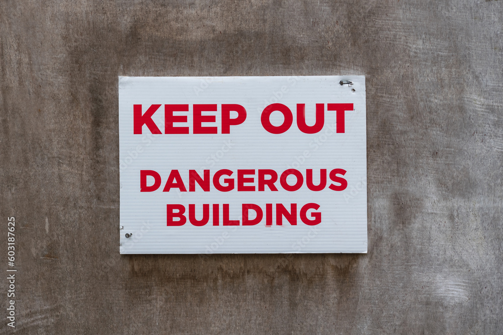 keep out dangerous building signage red letters on rectangular white ...