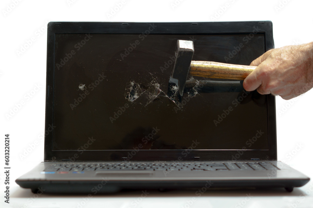 arm of a man breaking a laptop with a hammer isolated on white ...
