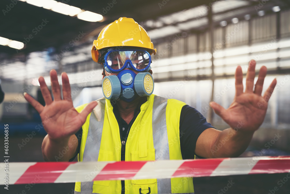 Chemical specialist wear safety uniform and gas mask showing his hands ...