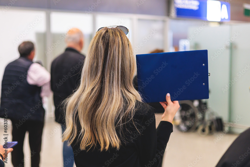 Meeting at the airport, person holding a placard card sign with welcome ...