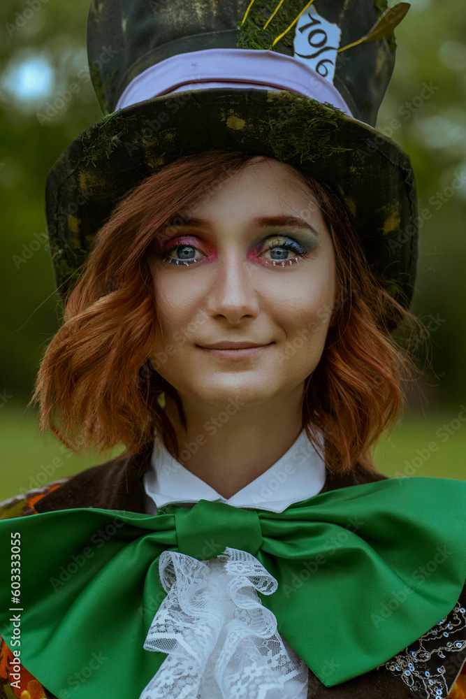 Beautiful woman as mad hatter with hats in nature Stock Photo | Adobe Stock