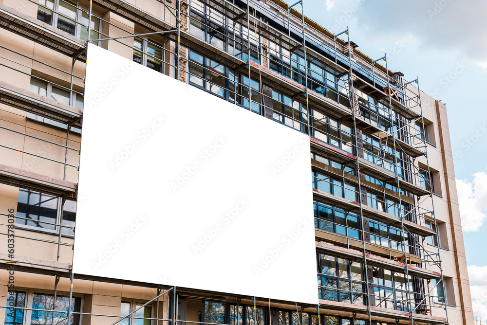 Advertisement billboard on scaffolding,signboard on building facade ...