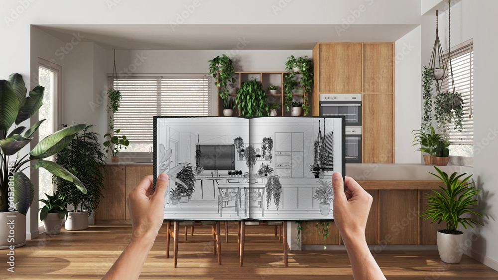 Hands holding notepad with kitchen design blueprint sketch or drawing ...